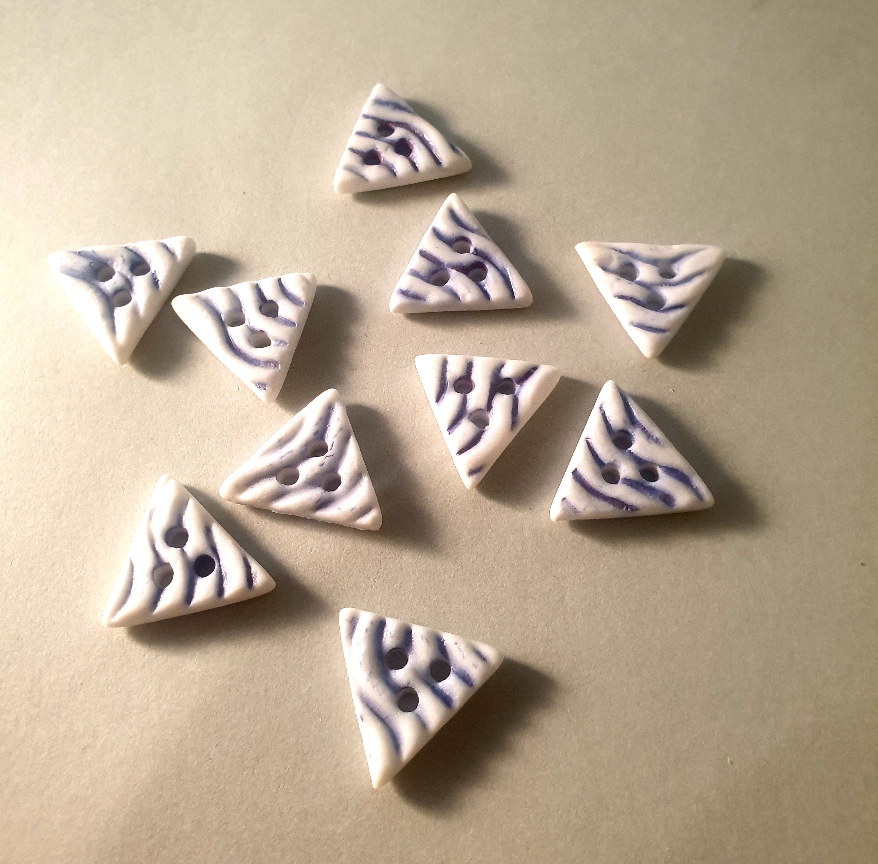 Triangular porcelain buttons. – Lynette Rogers Ceramics